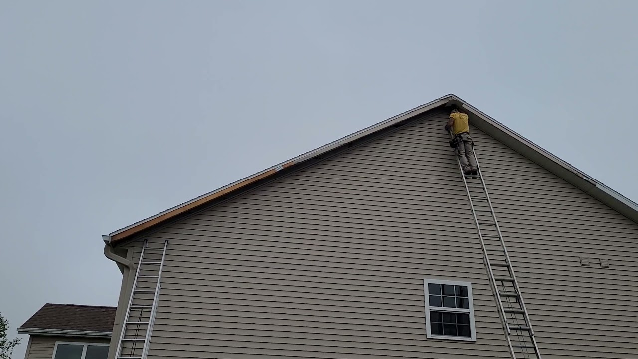 Installing soffit and fascia the hard way....a 28' and 32' ladder ...