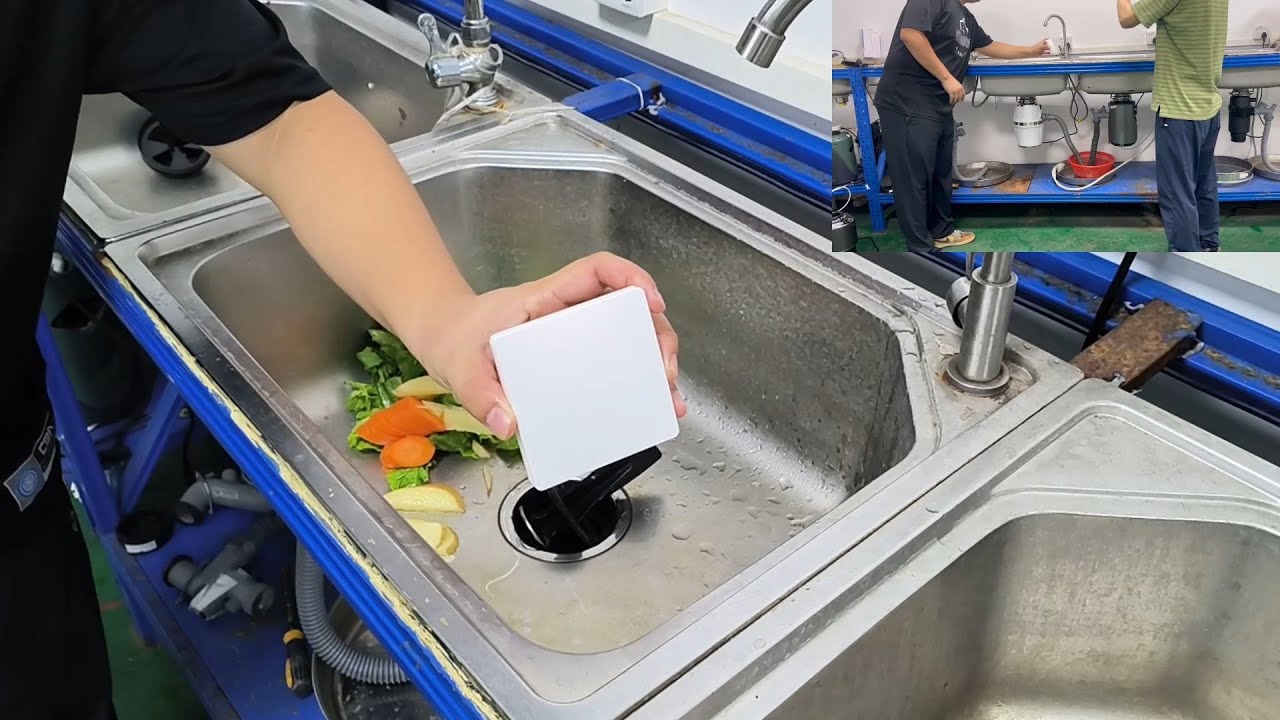Real-time process of garbage disposer grinding potatoes and oranges ...