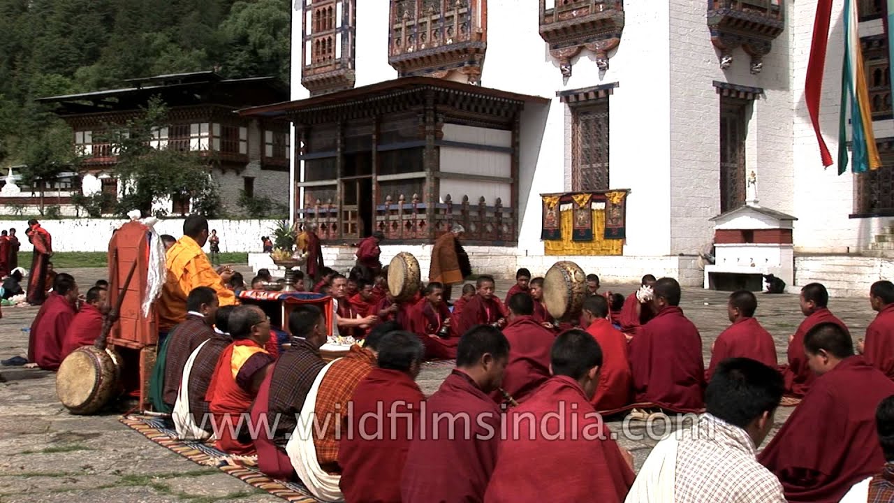 Monks performing rituals accompained by traditional music in Bumthang ...