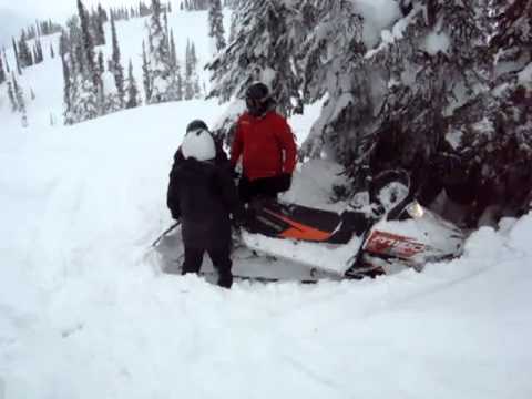 stuck sled in tree well - YouTube