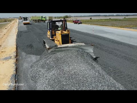 Komatsu Dozer Working On Road Construction , Clearing Gravel To ...