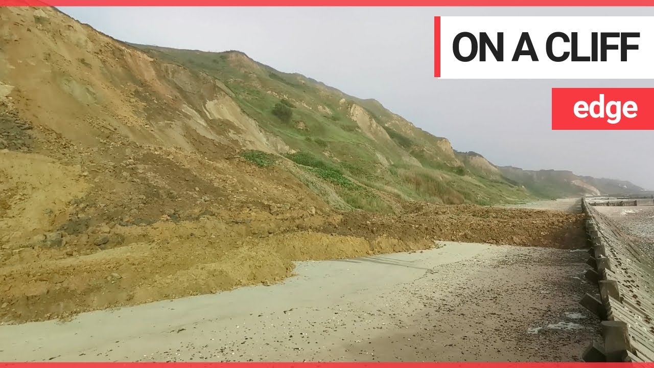 Dramatic footage shows huge landslide on a quiet beach | SWNS TV - YouTube