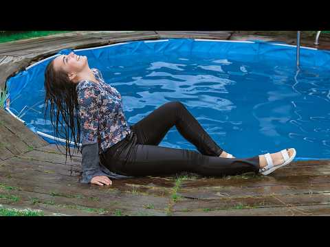 KARINA SLOWLY GETTING WET IN THE POOL OUTDOORS WITH ALL HER CLOTHES ON [WETLOOKER ID: b54-karina6]