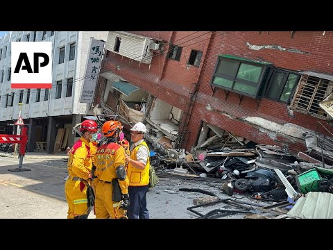Taiwan firefighters rush to the scene to rescue people trapped after ...