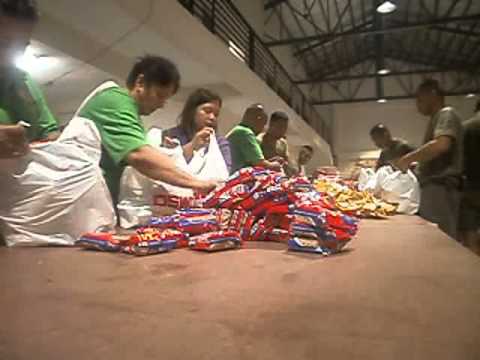 Civil Military Operations repack relief goods for Typhoon Glenda ...