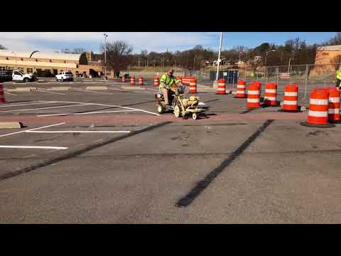 David Falin of the Kingsport traffic division uses a paint machine to ...