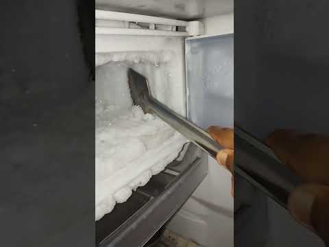 Scraping with a steel spatula ❄️🤍 #ice #freezer