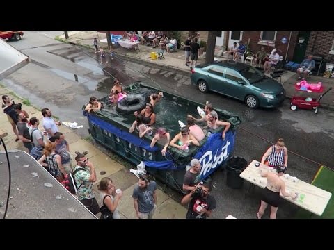 Partygoer Turns Dumpster Into a Swimming Pool For The Whole Street ...