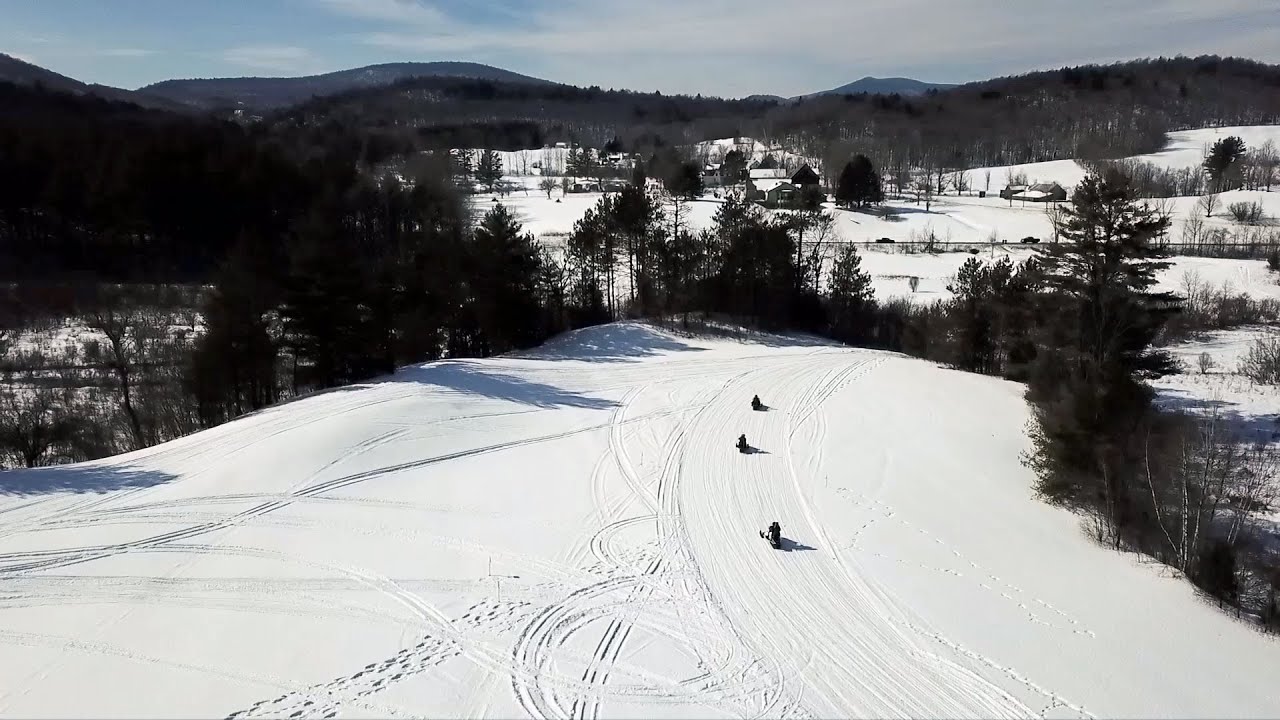 Cruising through the Calvin Coolidge State Park with Snowmobile Vermont ...