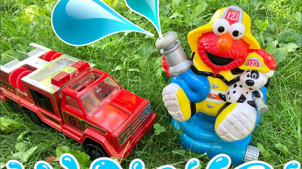 Fire Fighter WATER SPRINKLER FUN Elmo Sesame Street Toy - YouTube