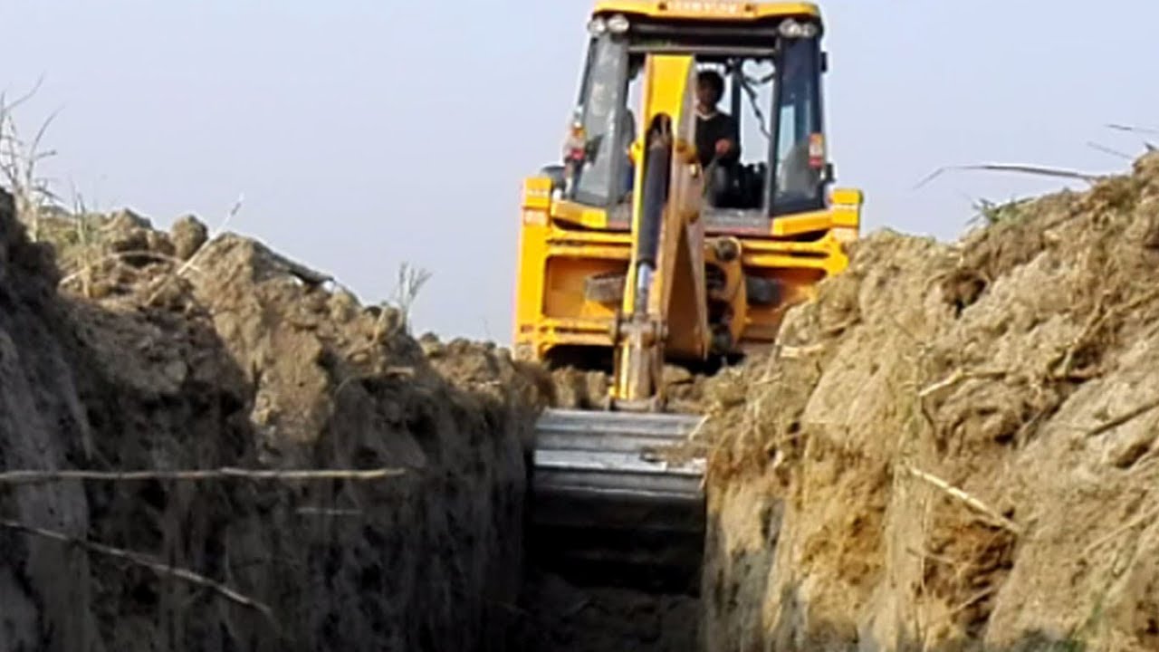 Facilitator-JCB Backhoe-Digging Road Track for Remote Village - YouTube