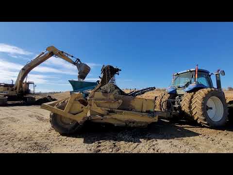 Screening  trim with Warrior 800 Powerscreen , Hauling with New Holland TG305 & ,Reynolds 14C pan