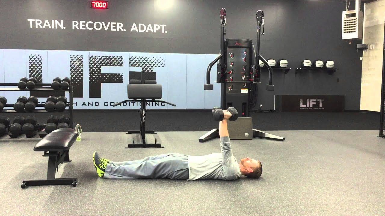 Supine Leg Drop with Iso DB Hold - YouTube