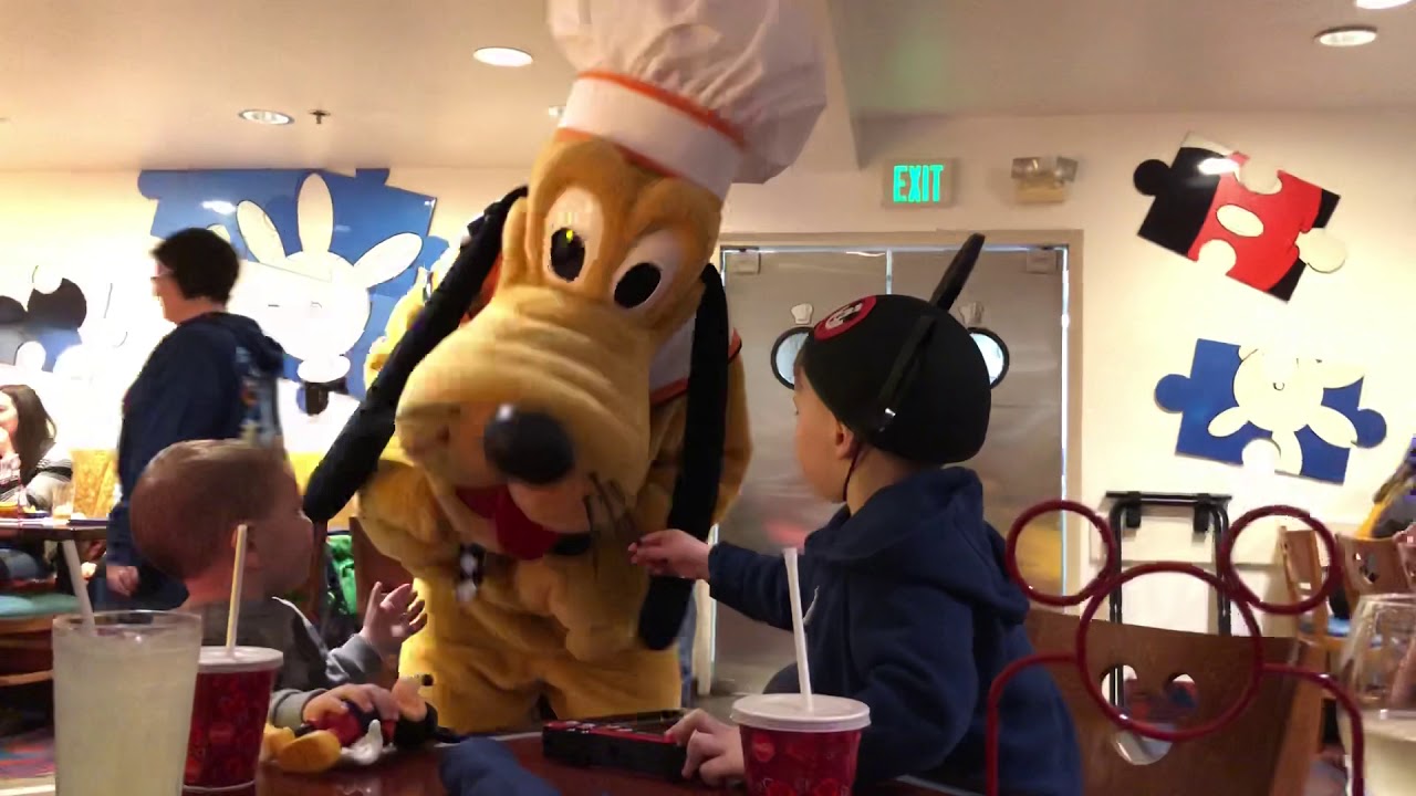 Kids with Pluto at chef mickeys Disney world Orlando - YouTube