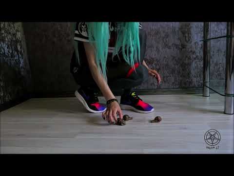 Woman with nike tanjun walks near a group of snails