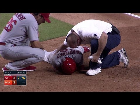 STL@MIA: Martinez is hit by a pitch in throwing arm