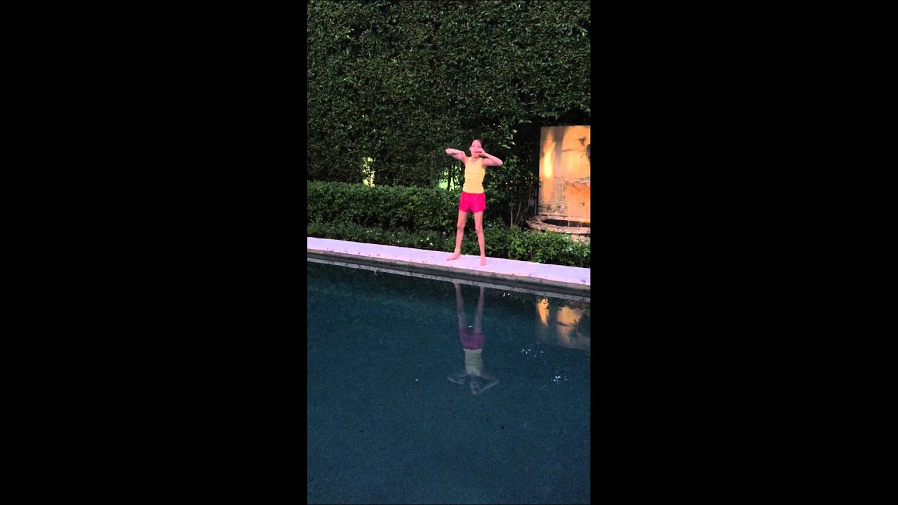 Girl falls into a pool while dancing - YouTube