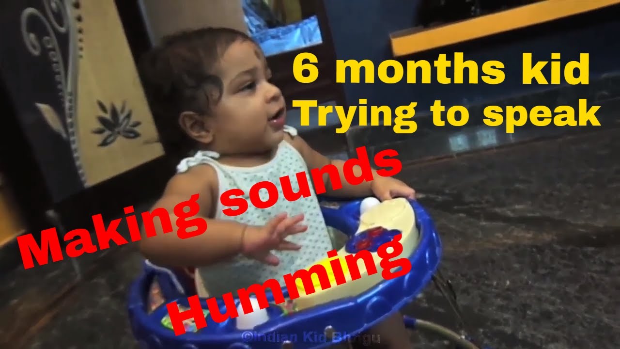 6 months kid trying to speak, humming and making sounds or uttering ...