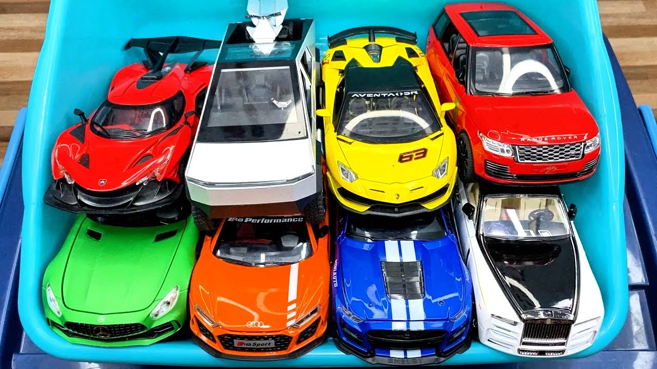 Box full of various miniature cars Jaguar, Peugeot, Renault, Hyundai ...