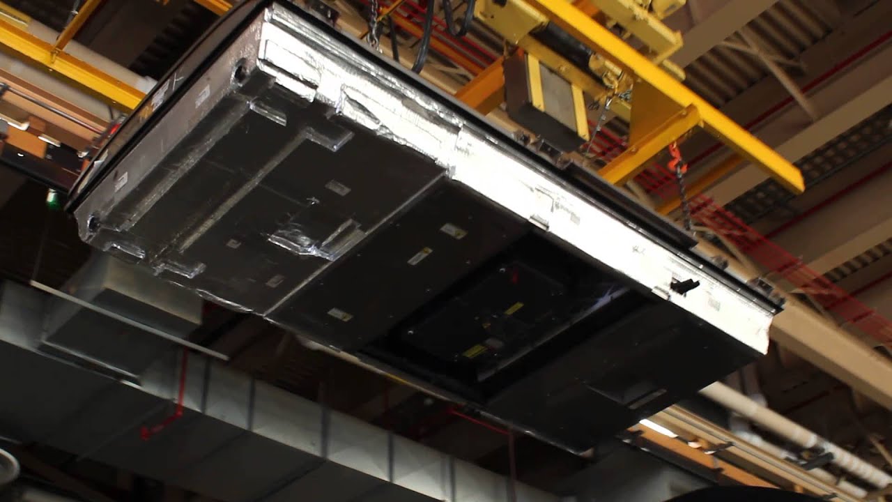 Lifting an HVAC unit back onto a train - YouTube