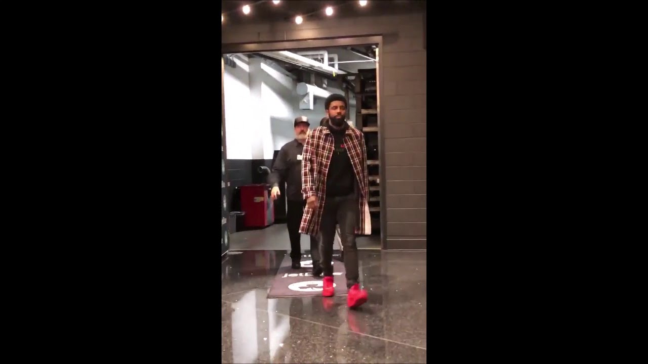 Kyrie Irving arrives to boston arena with an Native American feather in ...