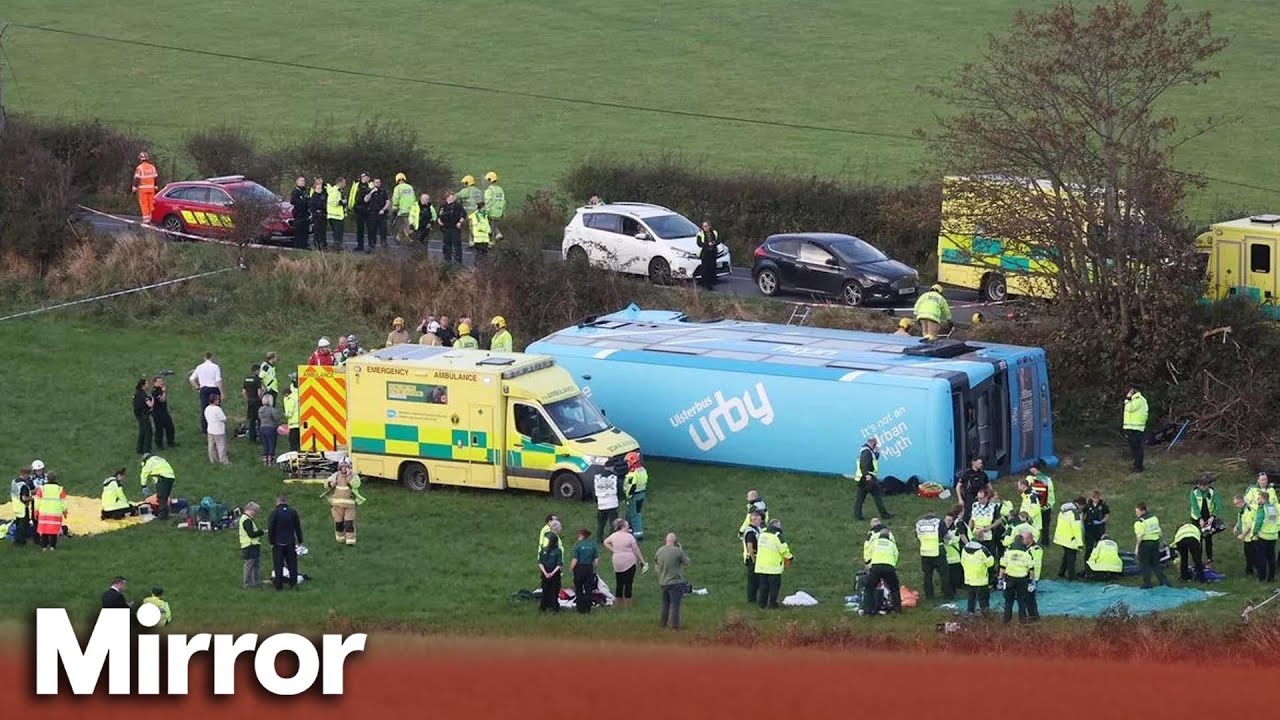 Bus overturns with 40 onboard as major incident declared - YouTube