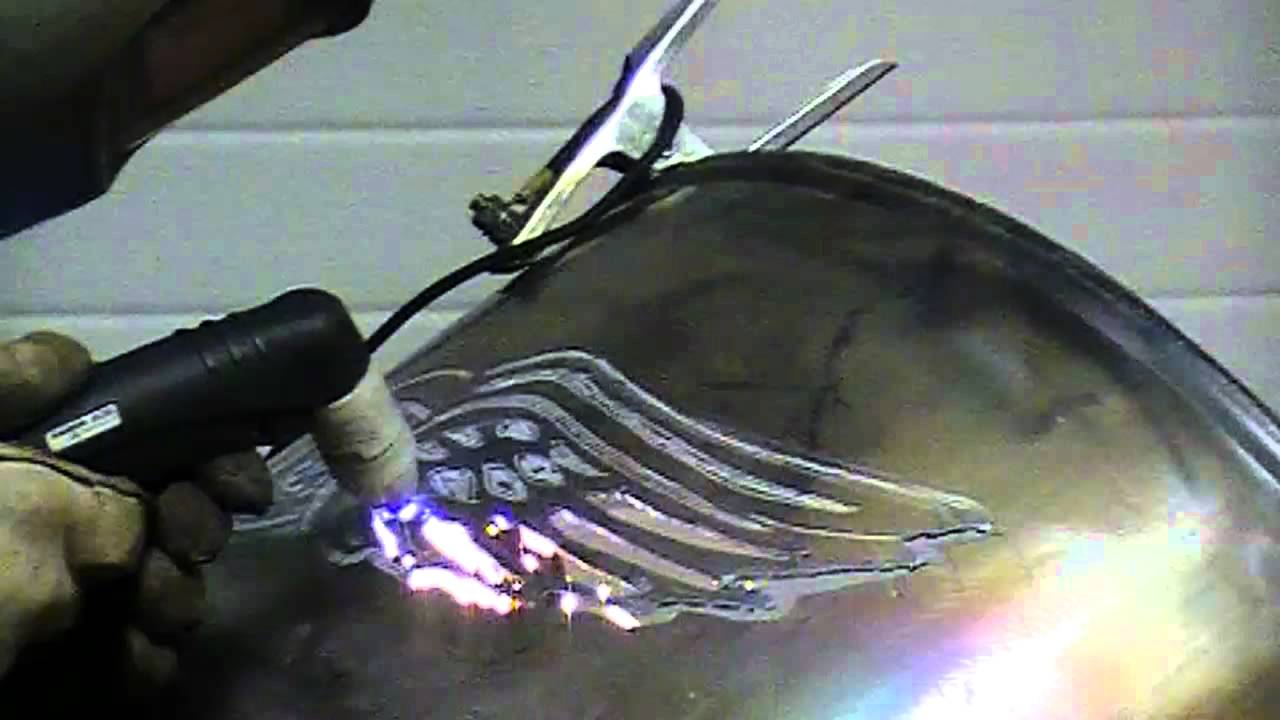 Ian Ives designing a Detroit Red Wings burn barrel / fire pit - YouTube