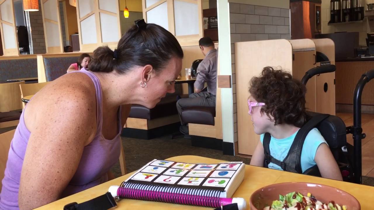 Angela talking using PODD and partner assisted scanning - YouTube