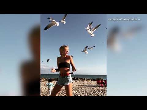 Hailey Baldwin flaunts model figure in a bandeau bikini top