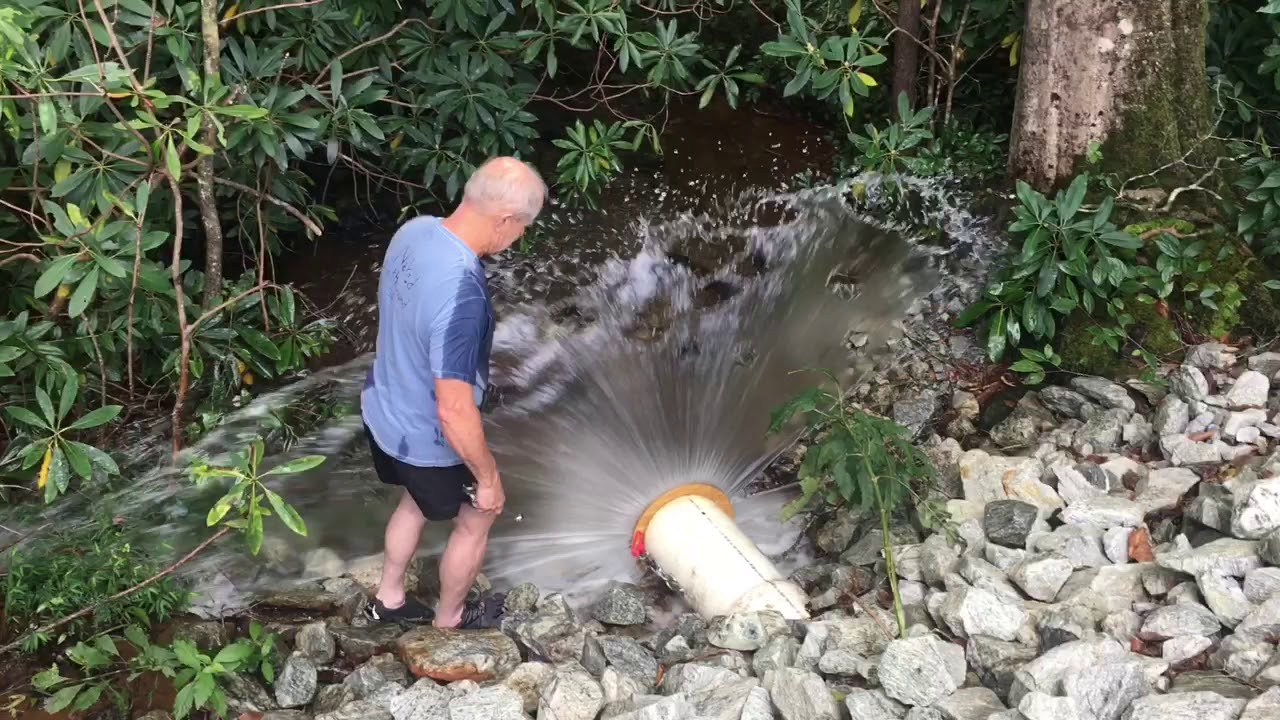 Charging a Siphon to Draw Down a Lake - YouTube