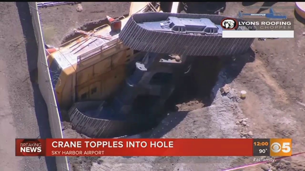 VIDEO: Crane topples near airport, 1 person missing - YouTube