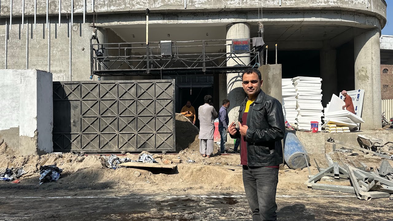 Gates installed outside Gaddafi stadium - YouTube