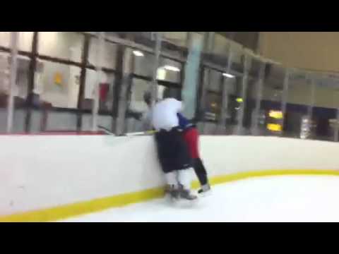 Junior hockey players gets hit through glass - YouTube