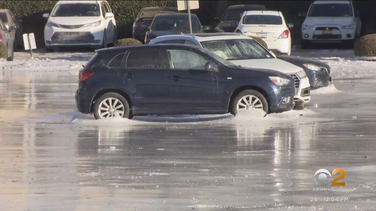 Cars remain frozen in iced-over Edgewater parking lot - YouTube