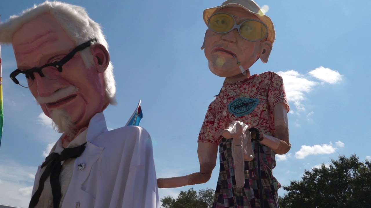 A giant Colonel Sanders puppet is interviewed at Forecastle - YouTube