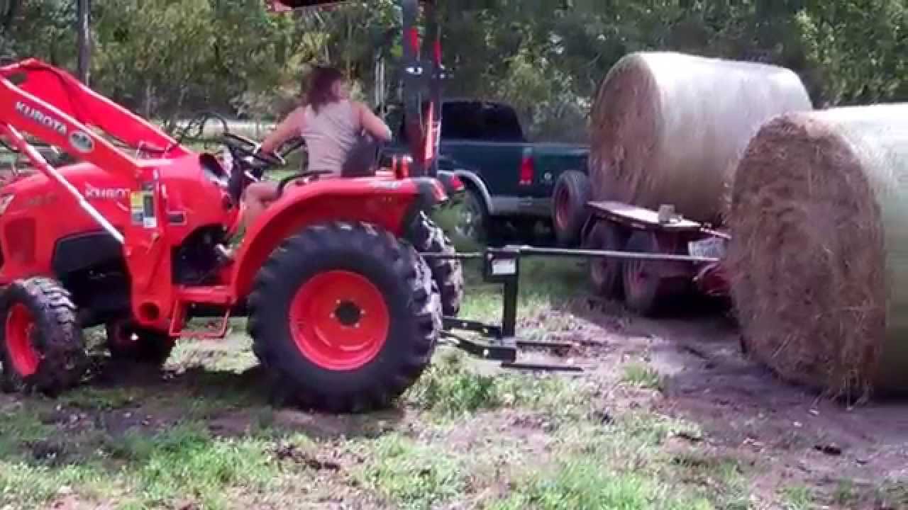 Girls kubota Tractor is to small to lift a round bail - YouTube