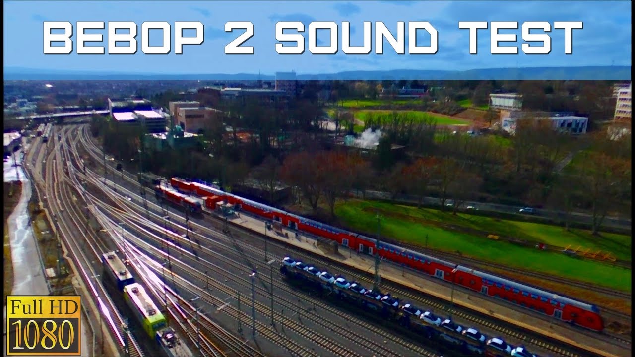 Parrot Bebop 2, original engine sound test, flight over train station ...