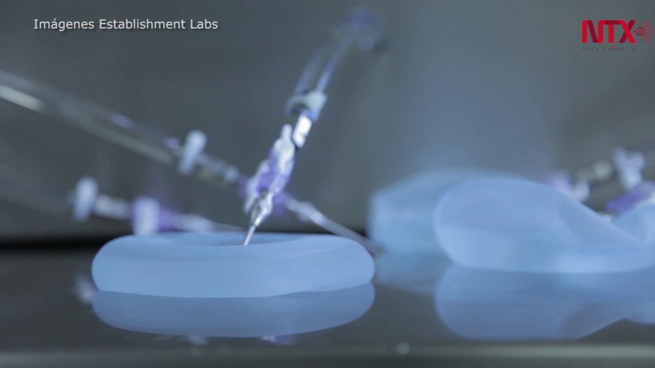 Presentan en Colombia implantes mamarios con microchip - YouTube