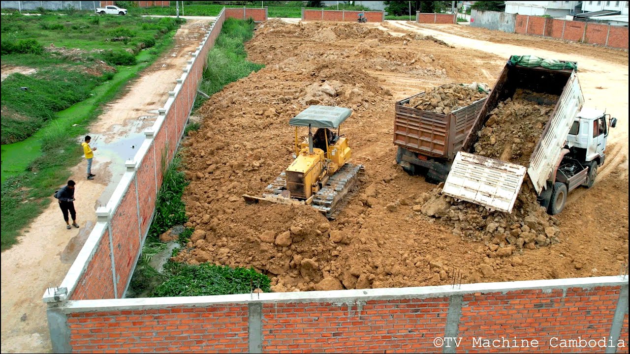 Completion of landfill huge project dump truck NISSAN, HYUNDAI, bulldozer spreading soil - YouTube