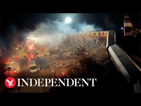 Smoke rises from train wreckage after collision leaves dozens dead ...