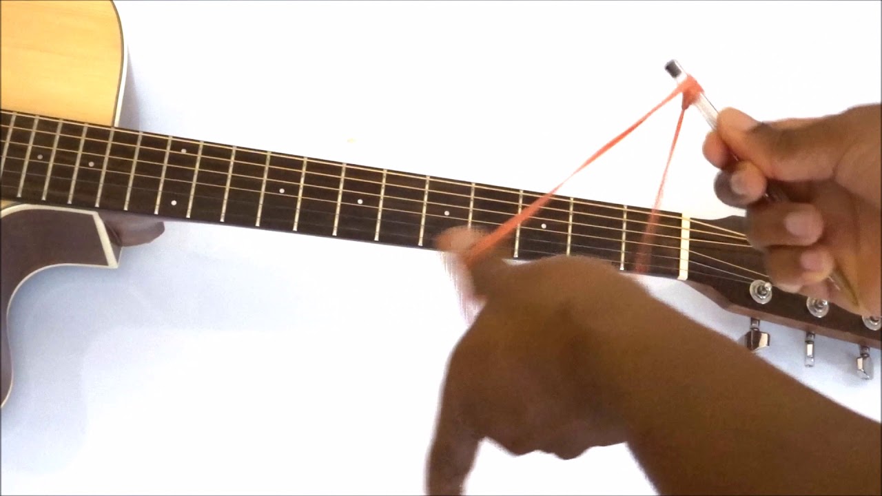 How to make your own GUITER CAPO using an elastic band and pen (Hack ...