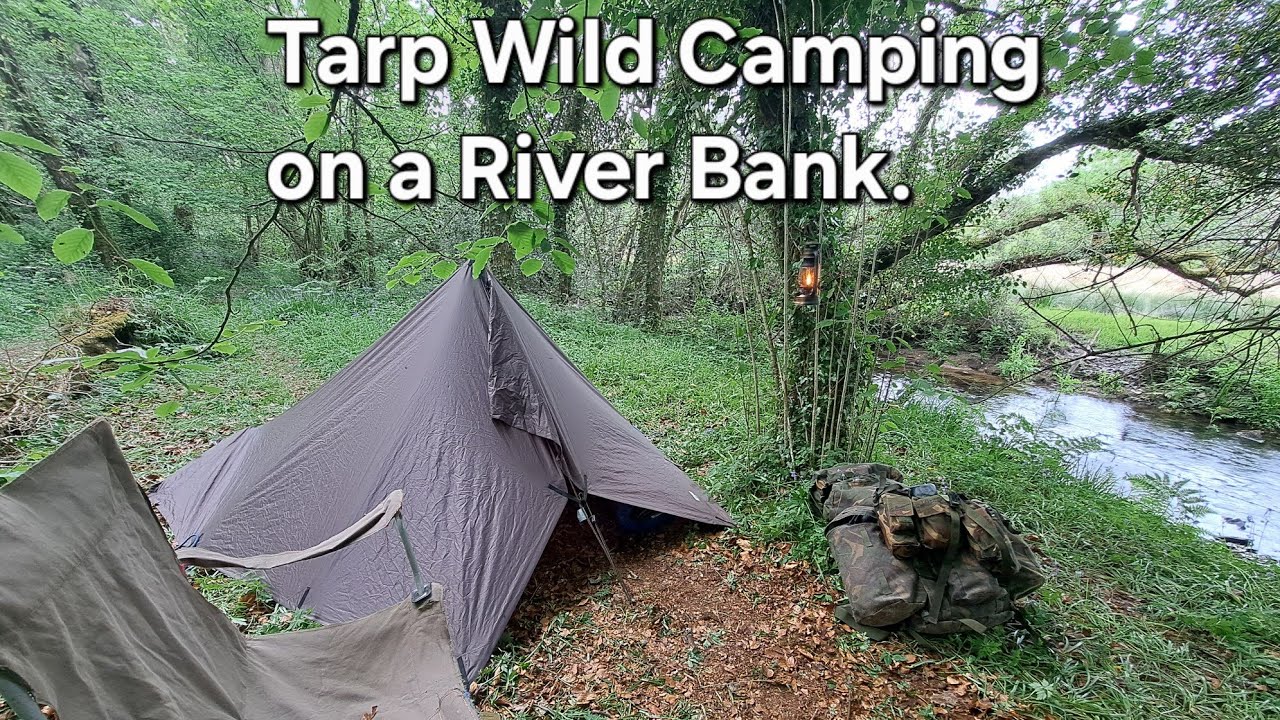 Tarp Wild Camping on a River Bank in the woods. Skimming stones and ...
