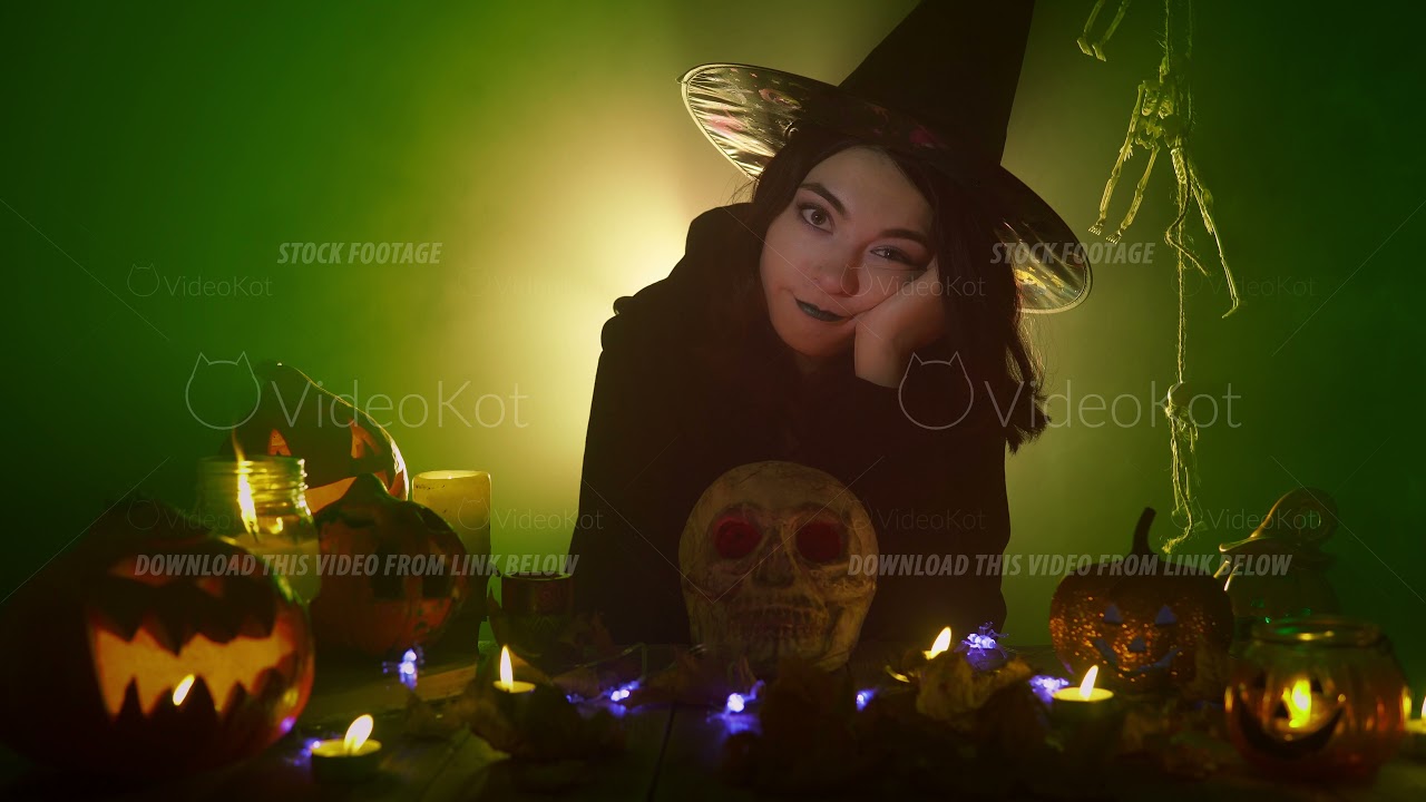 Bored witch sits surrounded by jack o'lanterns and skull - YouTube