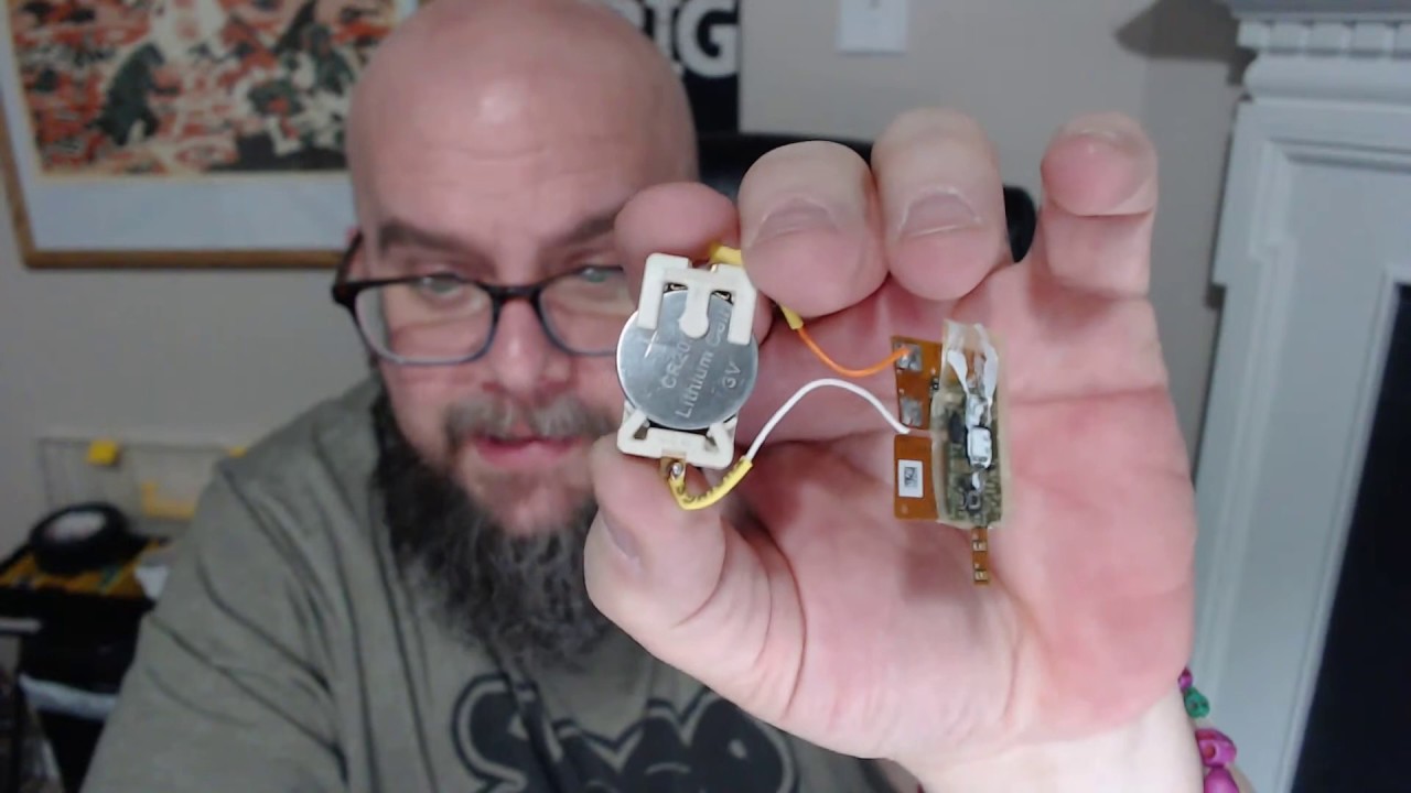Replacing the battery in a Tile Slim. IT IS POSSIBLE if you aren't a ...