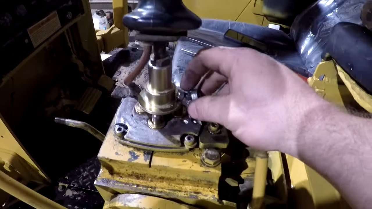Fixing broken and leaking pilot control joystick on cat d3c dozer - YouTube