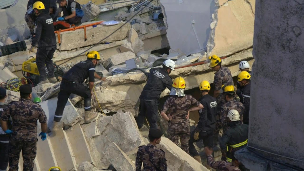 Rescuers search for survivors of Jordan building collapse | AFP - YouTube