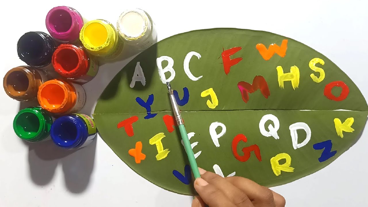 Learning to write English alphabet randomly on green leaf for kids and ...