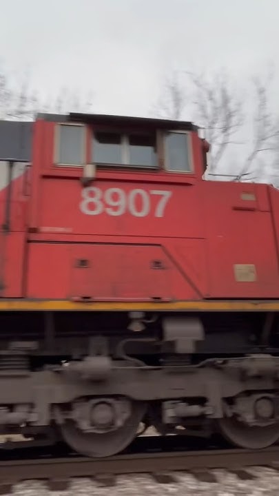 CN 8907 leads U702 loaded ore train into North Bessemer yard - YouTube