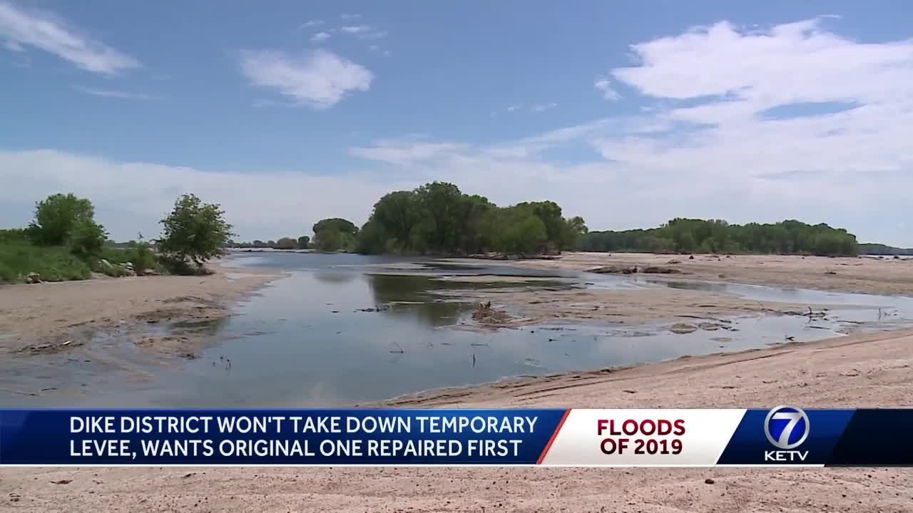 Dike district won't take down temporary levee, wants original one ...