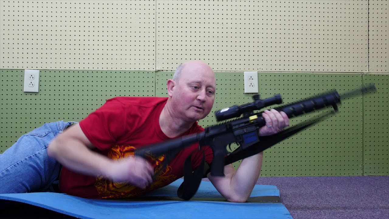 Positioning head with extra low mounted scope for optimum cheek weld ...